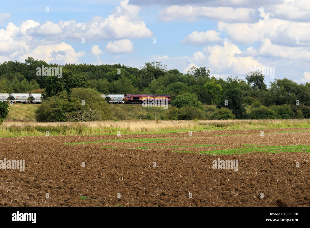 EWS freight train hauling Castle Cement wagons through the British ...