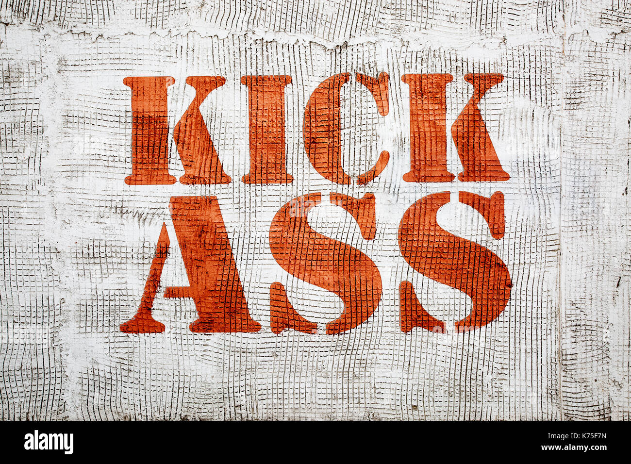 kick ass - red graffiti sign on a stucco wall Stock Photo - Alamy