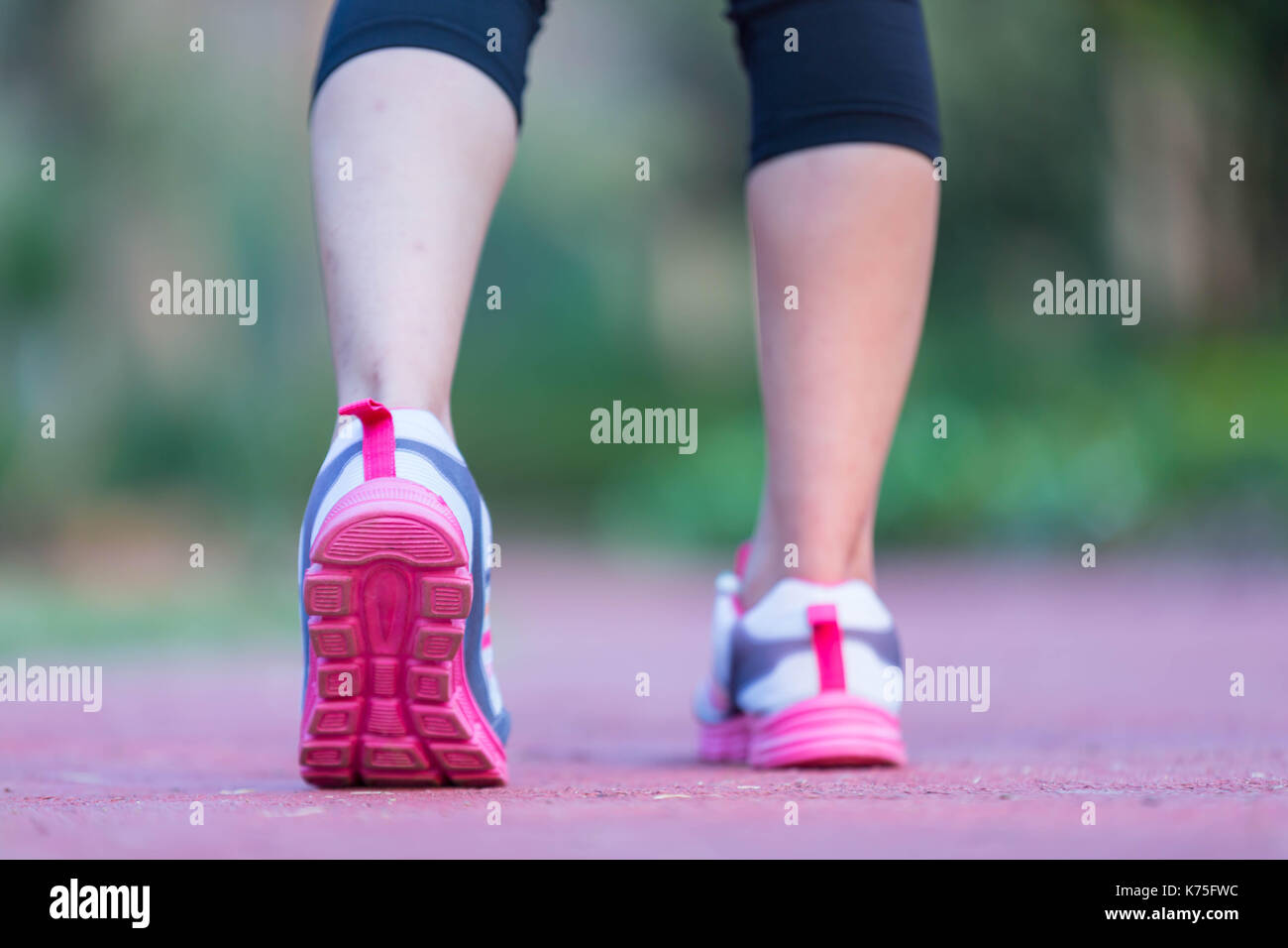 young fitness woman legs running Stock Photo - Alamy