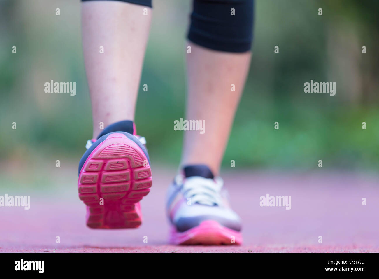 young fitness woman legs running Stock Photo - Alamy