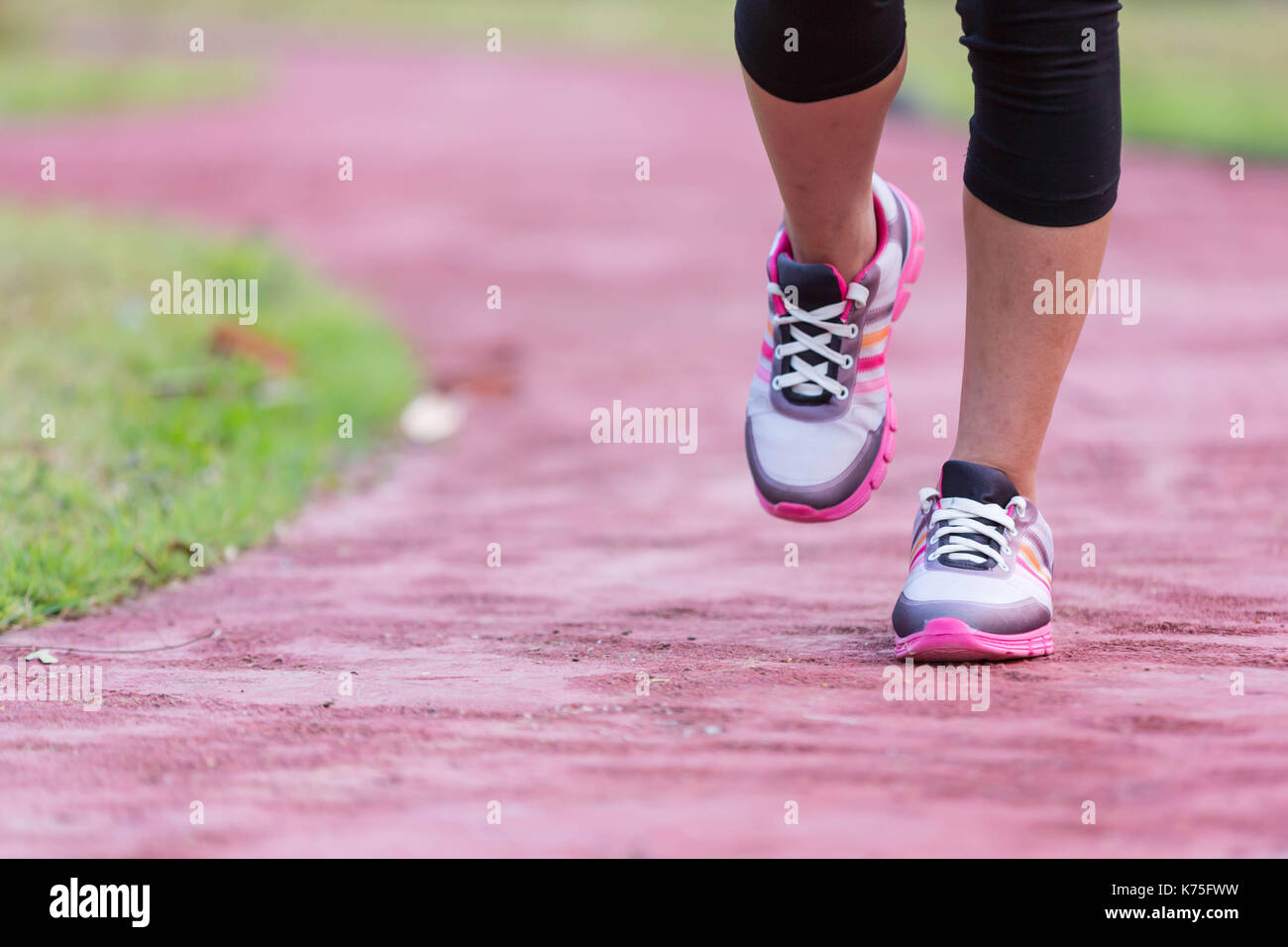young fitness woman legs running Stock Photo - Alamy