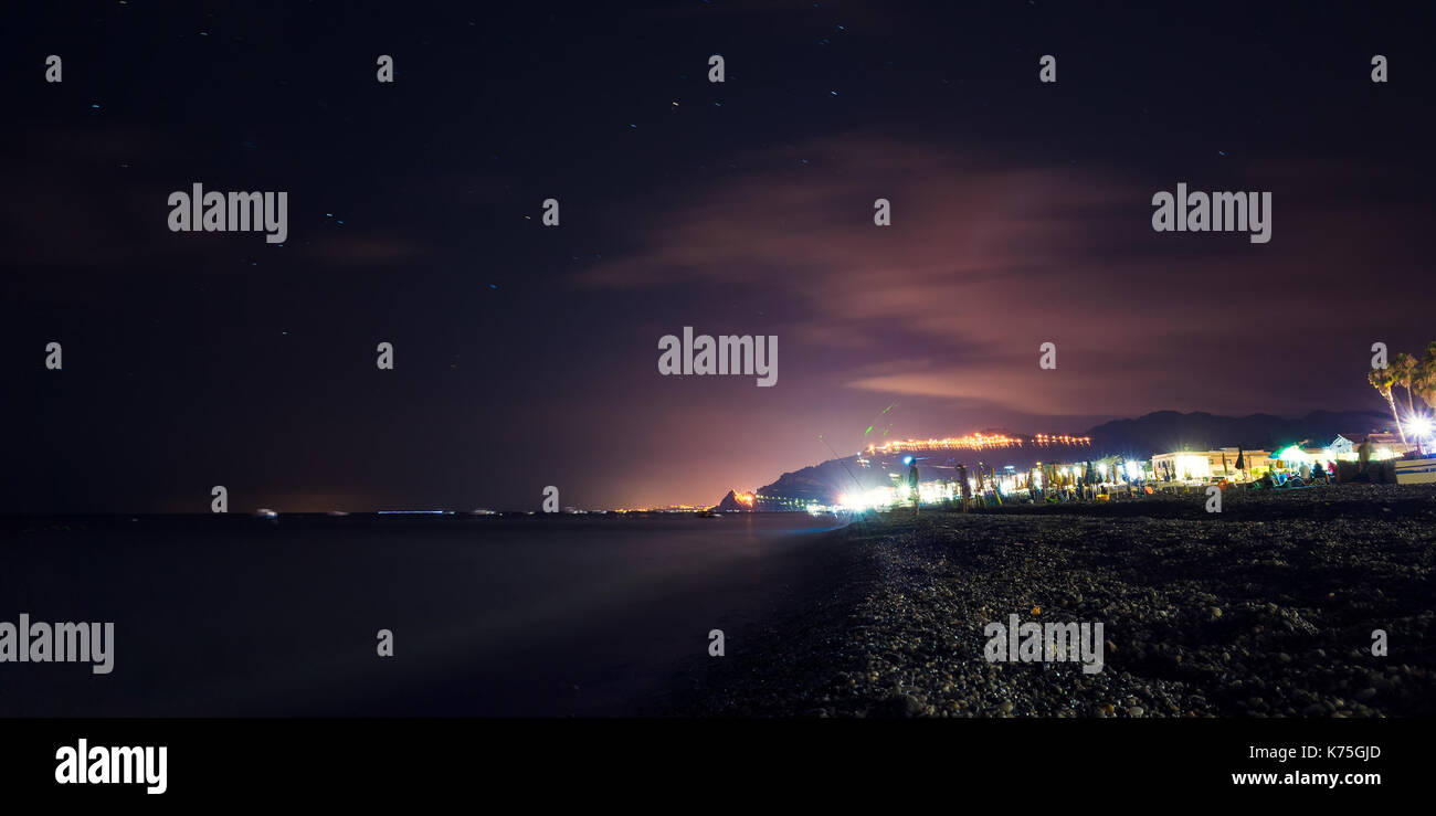 Clear summer night over the sicilian coast, Furci Siculo, Italy. The ...