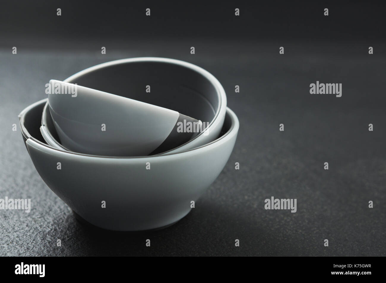 Various types of bowl on black background Stock Photo - Alamy