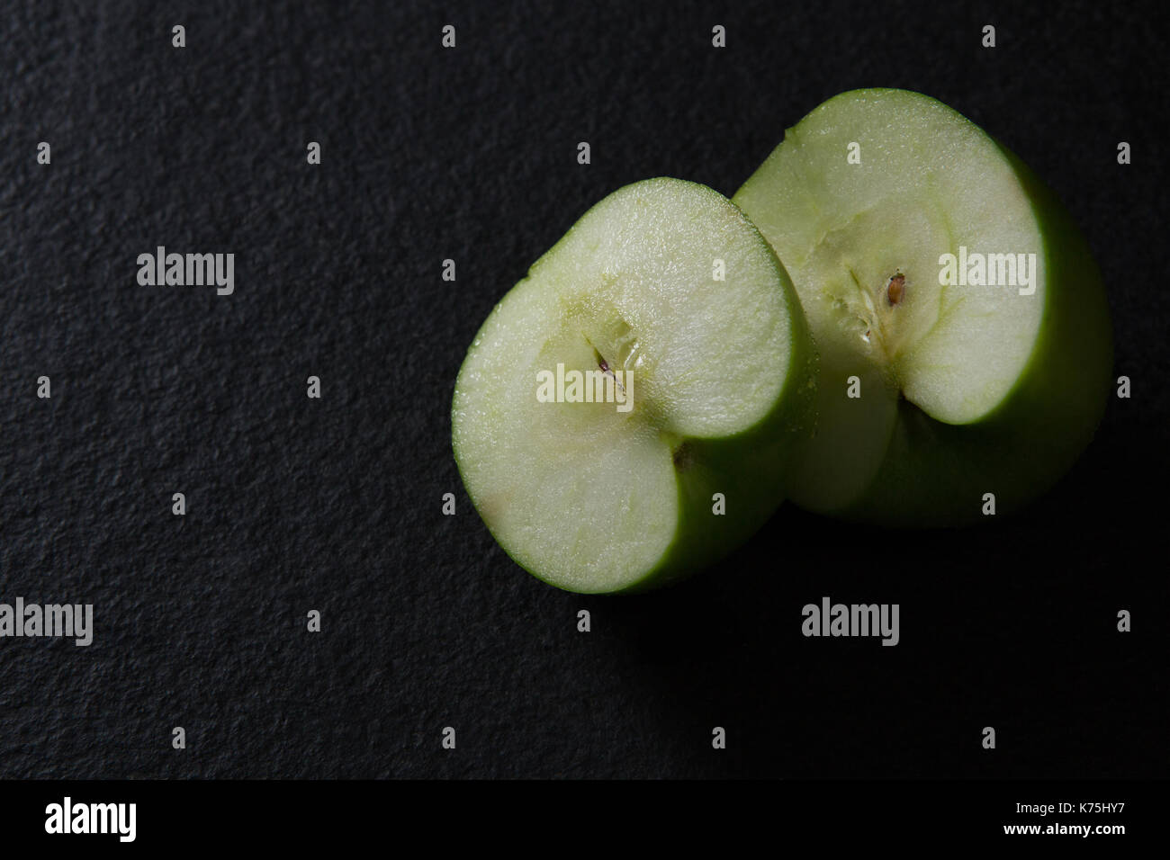 Halved green apple hi-res stock photography and images - Alamy
