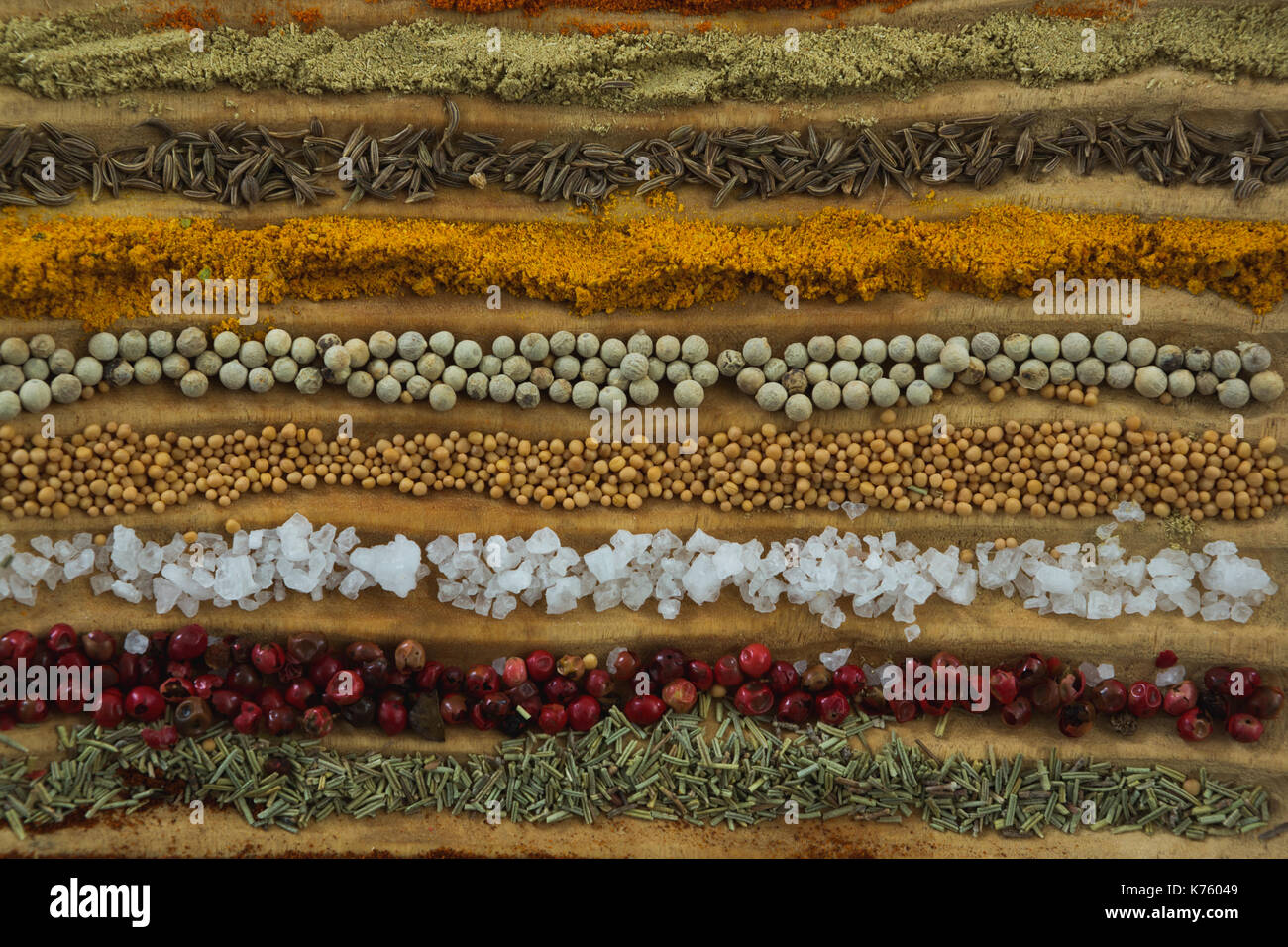 Overhead of various spices arranged in row Stock Photo - Alamy