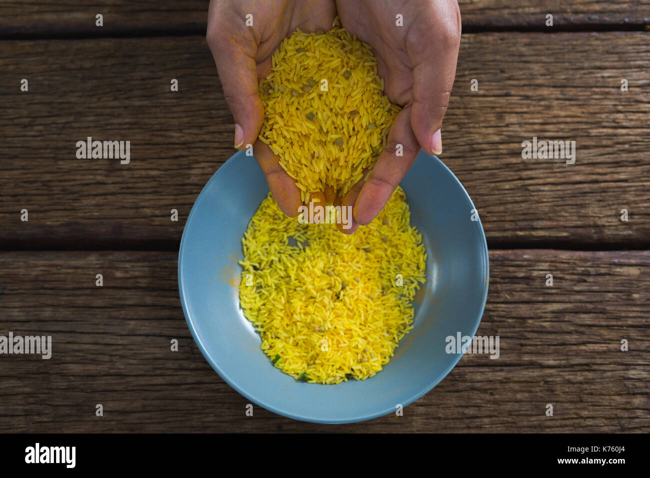 Hand pouring rice hi-res stock photography and images - Alamy