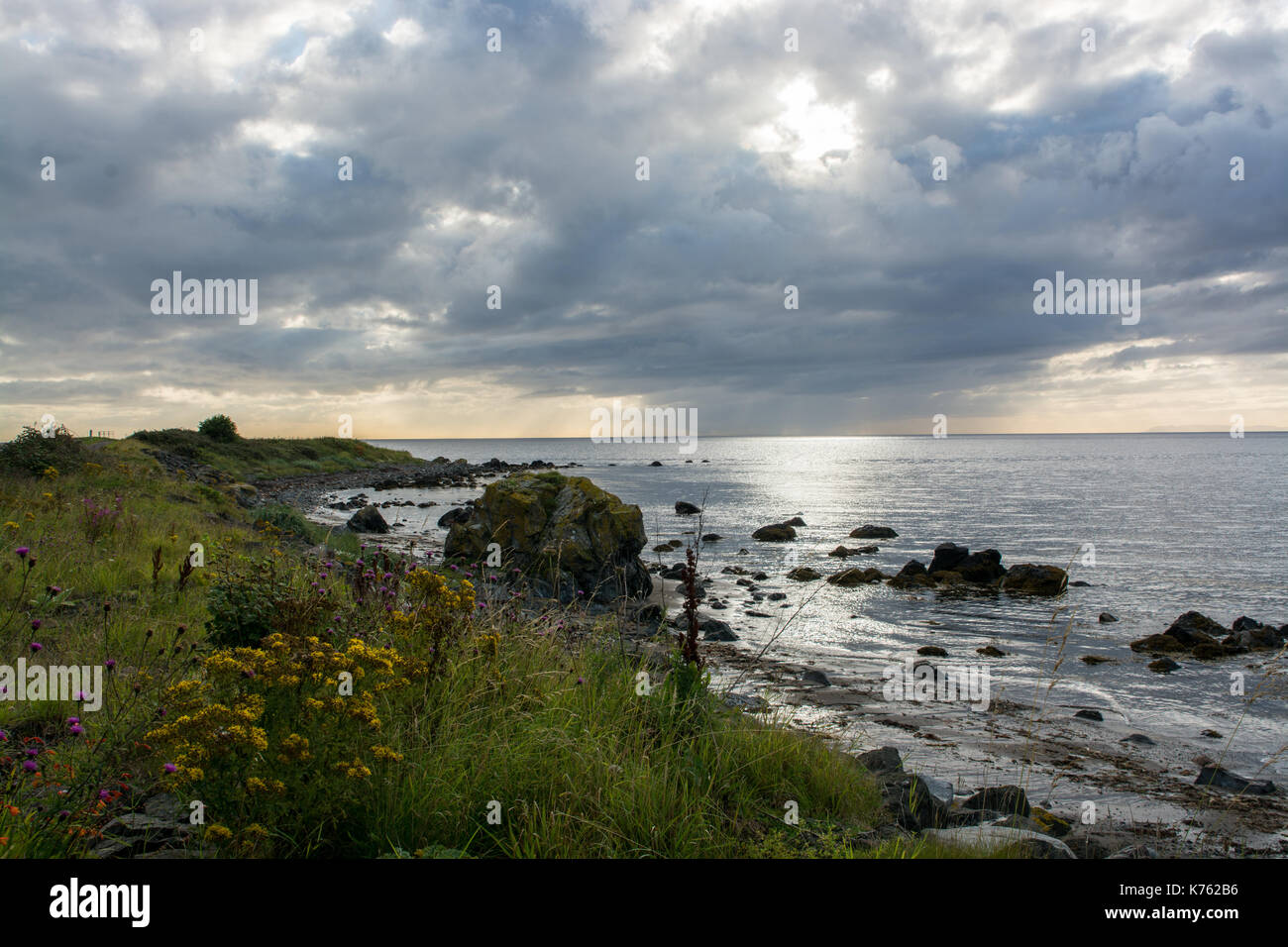 Sunset with red skies over the sea and beach from Lendalfoot near ...
