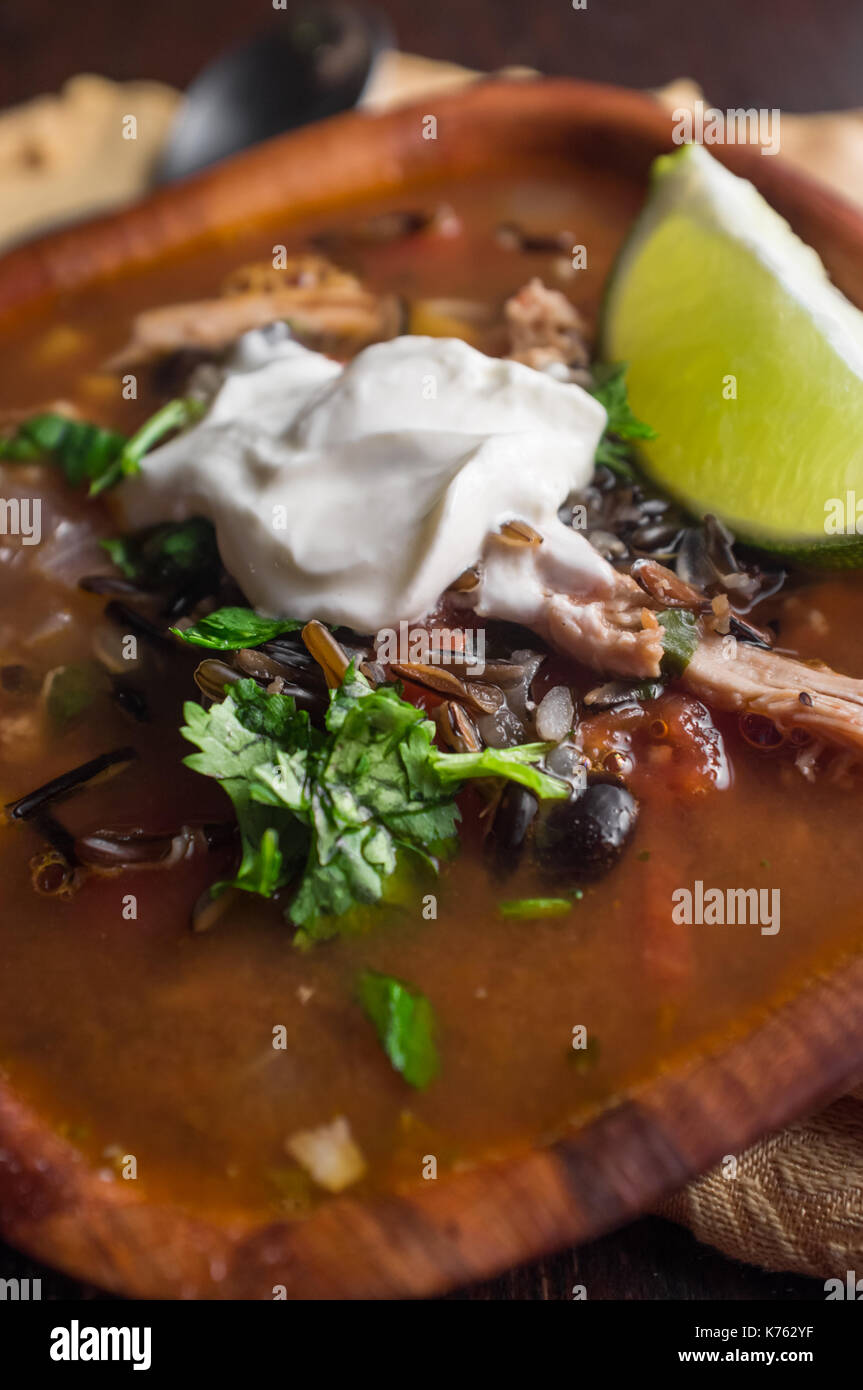 Fresh hot South American Aztec soup with cream and lime Stock Photo - Alamy