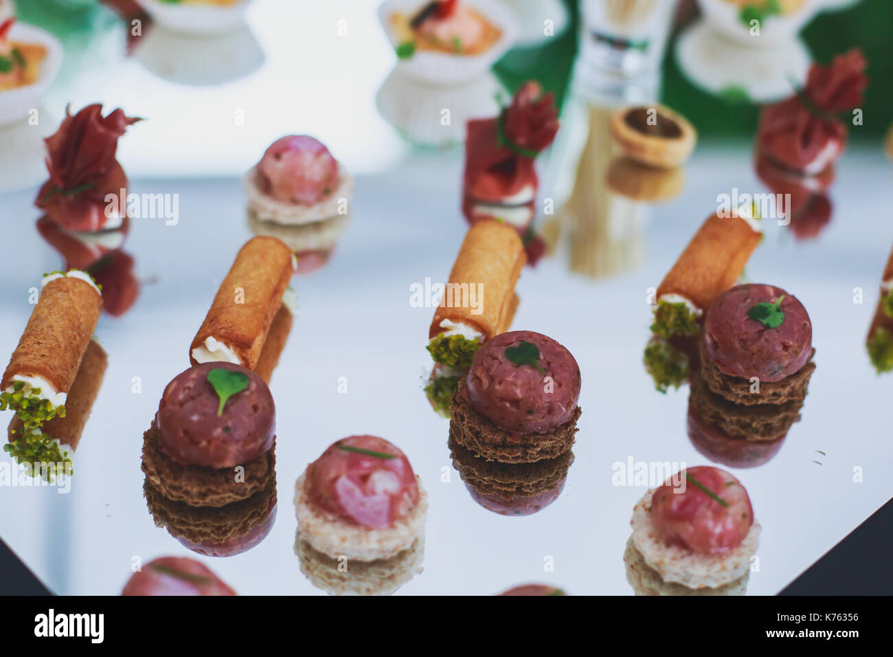 Beautifully decorated catering banquet table with different food snacks ...