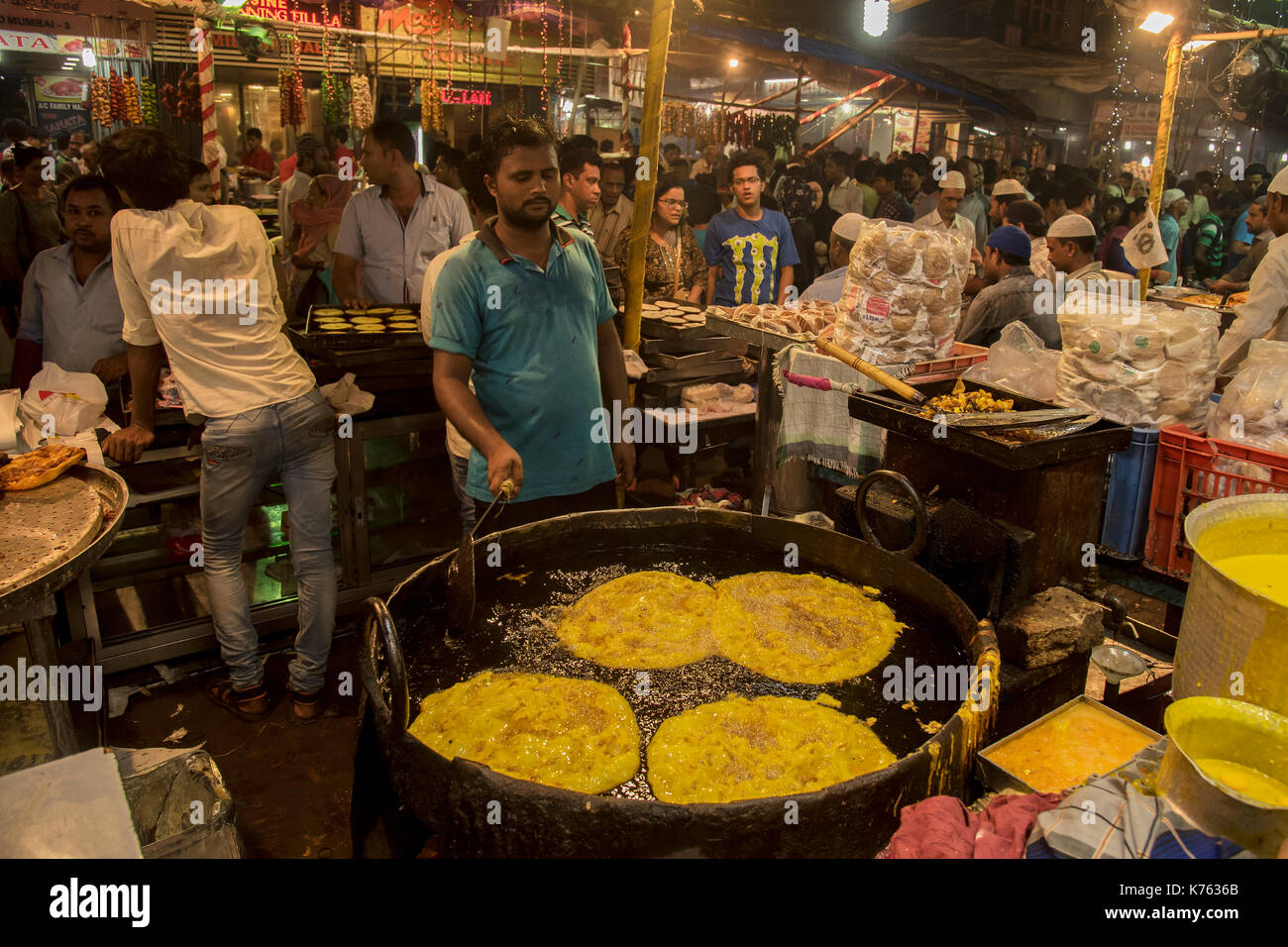 The image ofa food vendor prepare sweet Malpua eatables as Muslims ...