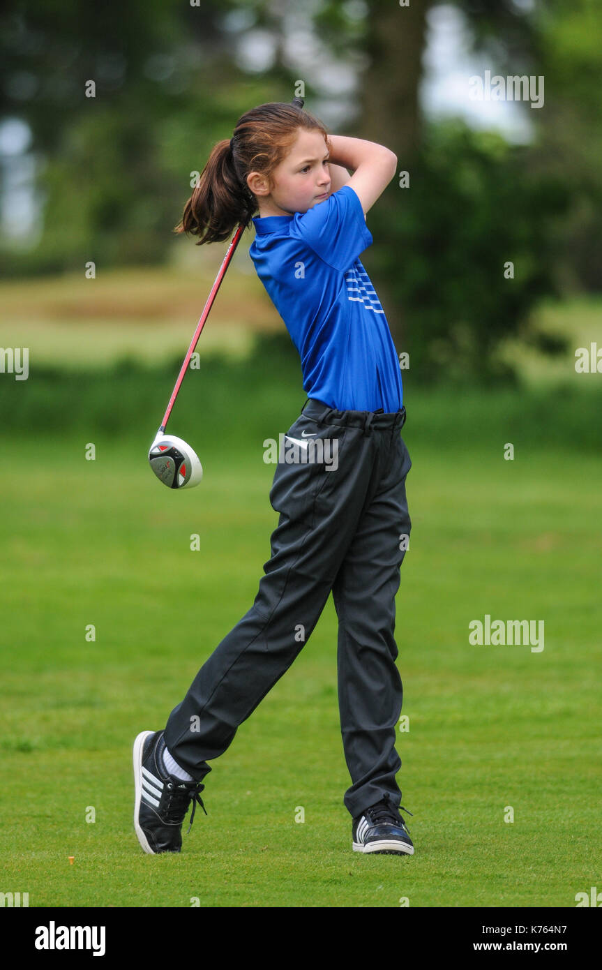 Junior child teenager playing golf in England UK Stock Photo - Alamy