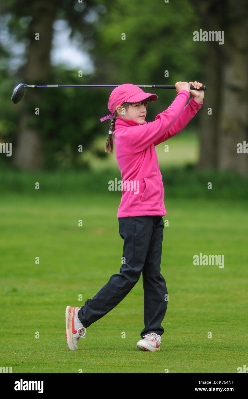 Junior child teenager playing golf in England UK Stock Photo - Alamy