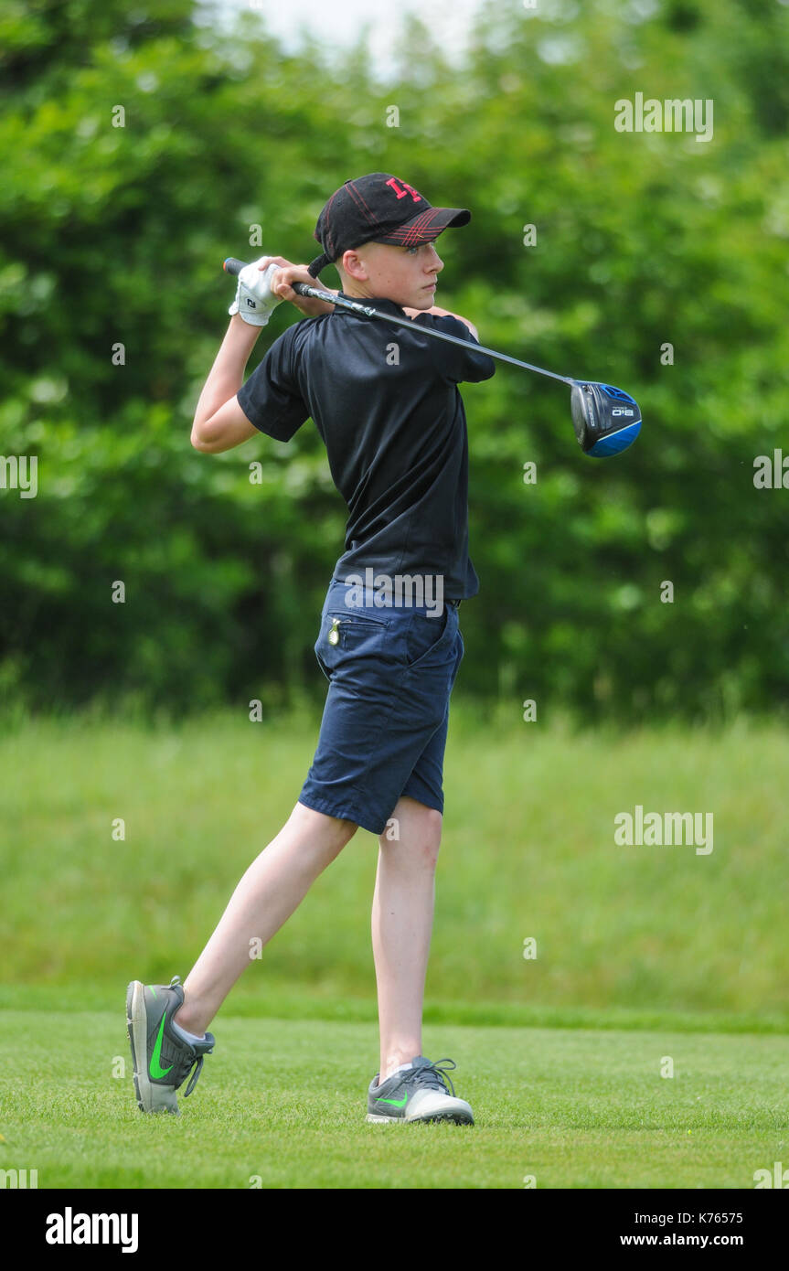 Junior child teenager playing golf in England UK Stock Photo - Alamy