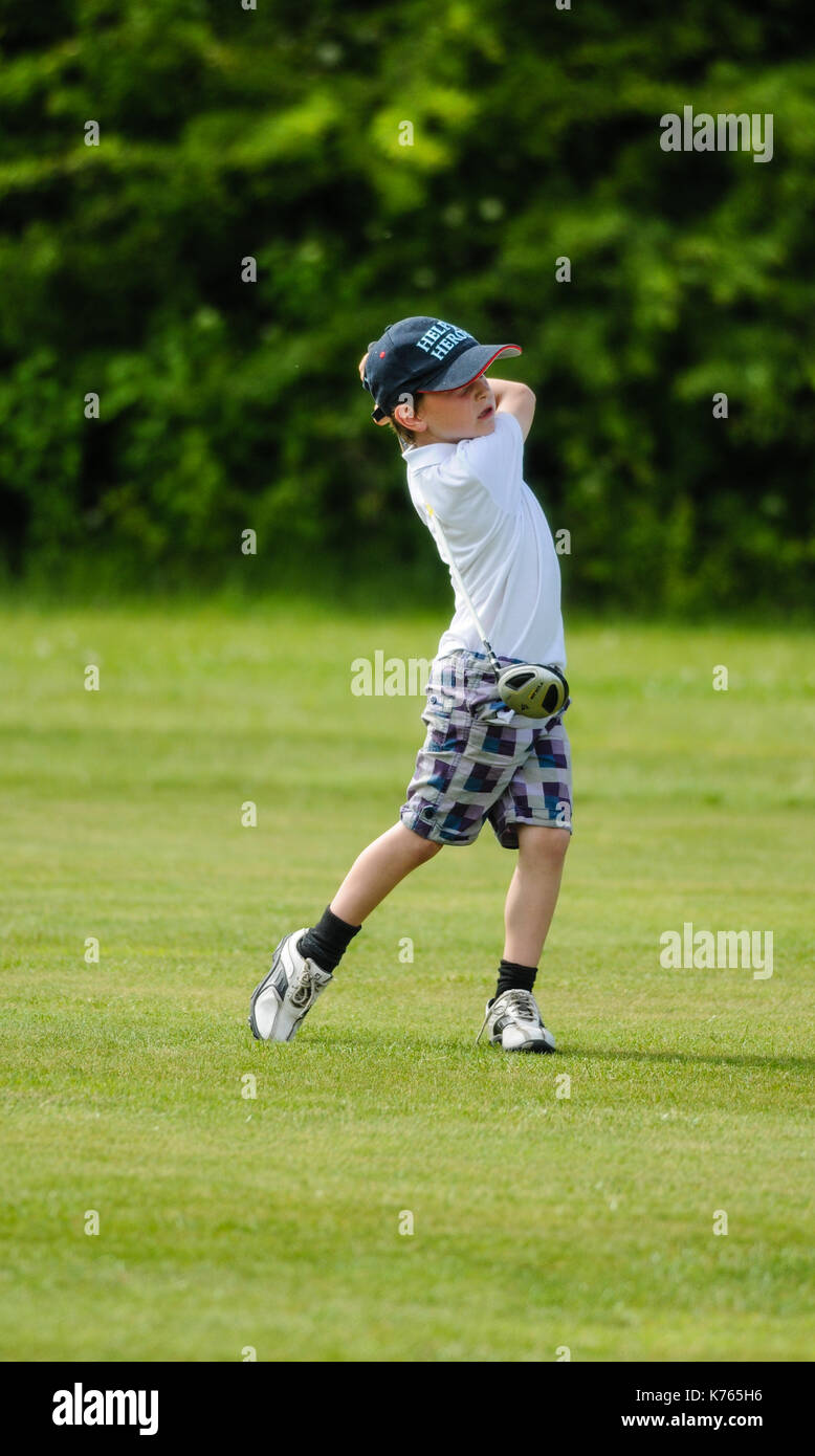 Junior child teenager playing golf in England UK Stock Photo - Alamy