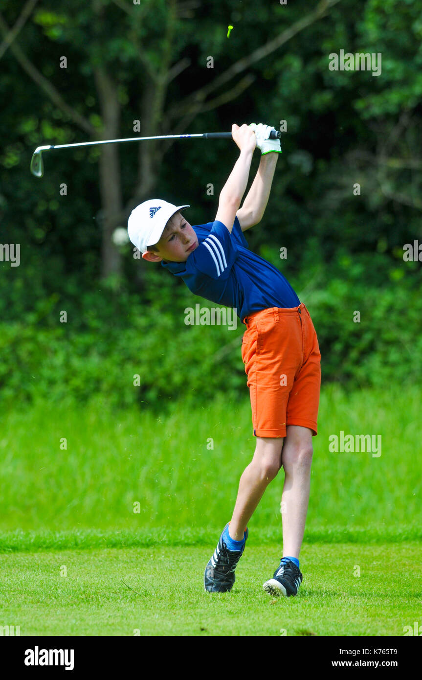 Junior child teenager playing golf in England UK Stock Photo - Alamy