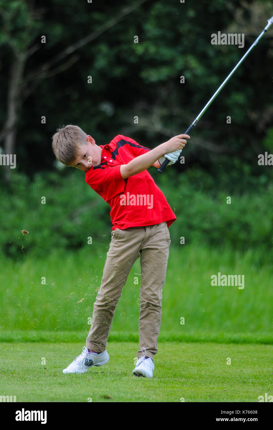 Junior child teenager playing golf in England UK Stock Photo - Alamy