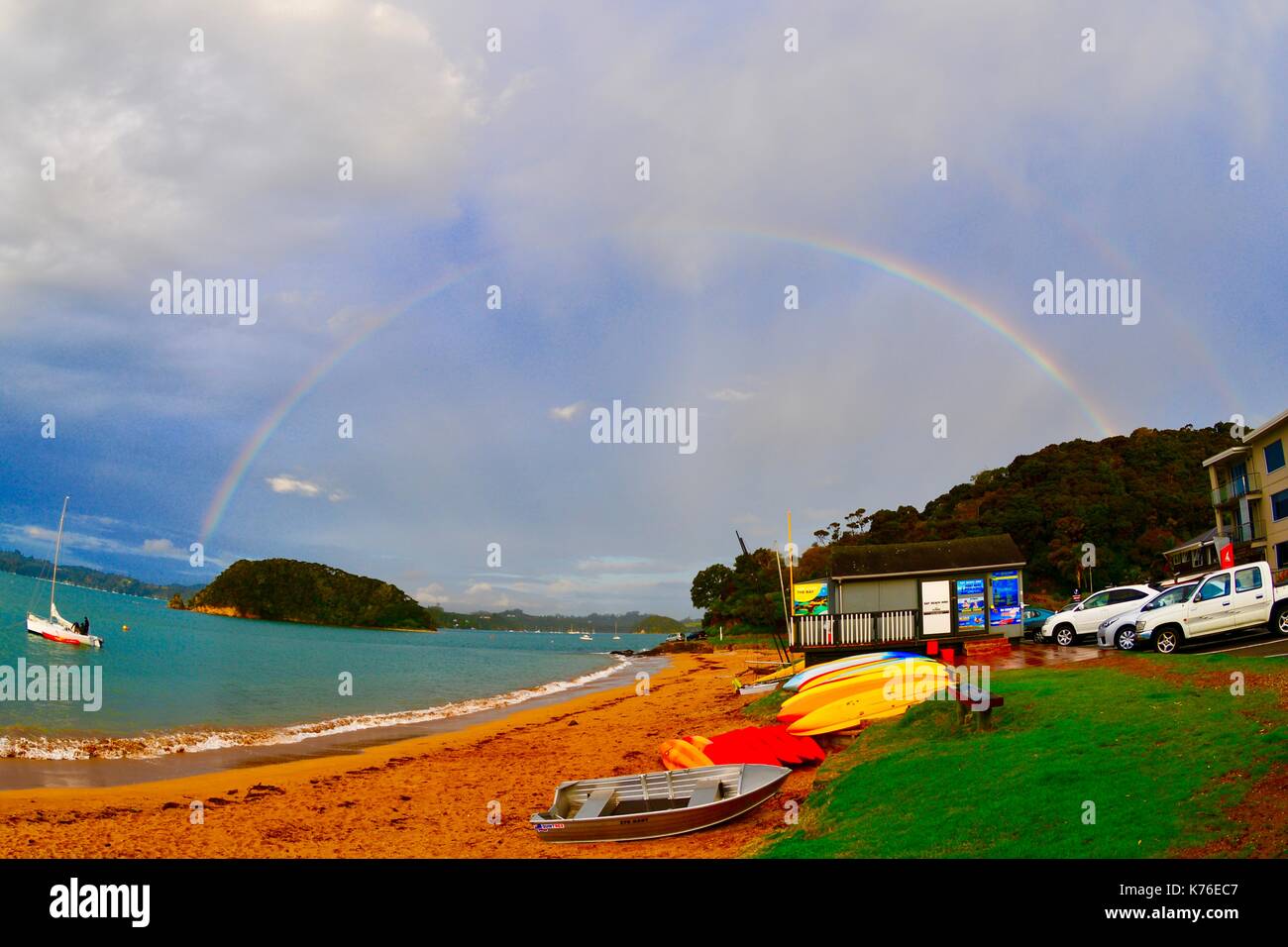 Rainbow over the Baby of Islands Stock Photo - Alamy