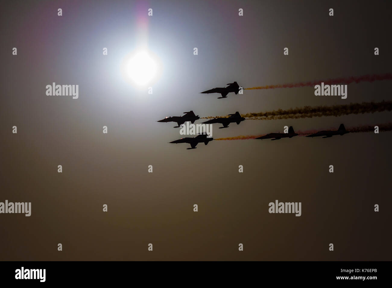 Turkish acrobatic aviation squadron flying over Izmir (Turkey). Backlit ...