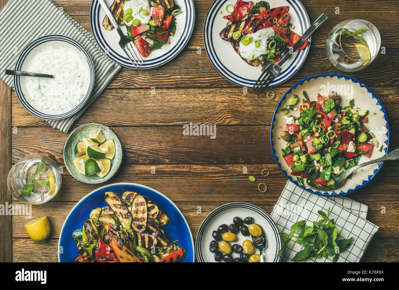 Flat-lay of healthy vegetarian dinner table setting Stock Photo - Alamy