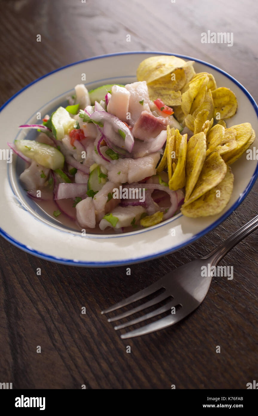 Chilled spicy ceviche with crispy fried plantain chips Stock Photo - Alamy
