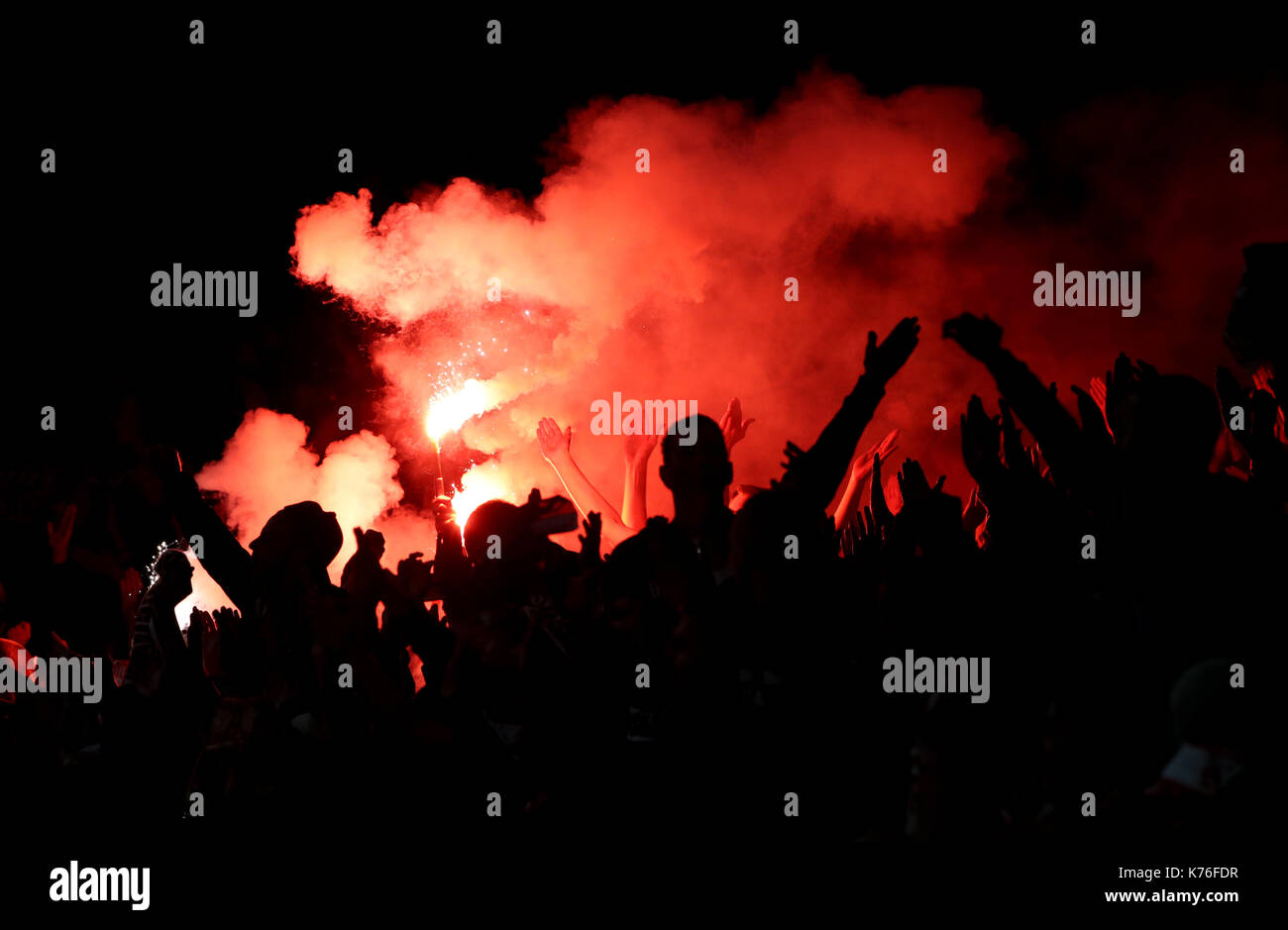 FC Koln fans set off a flare in the stands during the Europa League ...