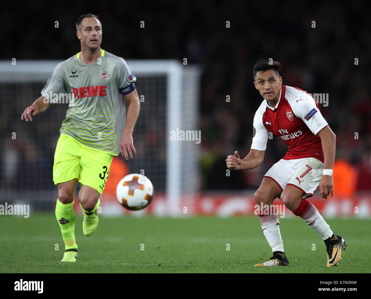 Arsenal's Alexis Sanchez (right) and FC Koln's Mathias Lehmann during ...