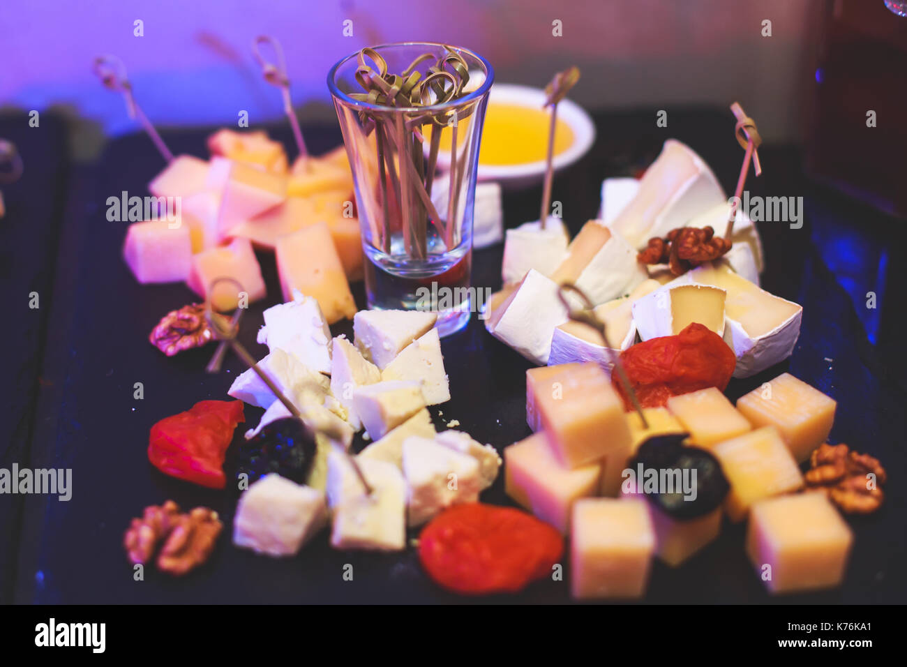 Beautifully decorated catering banquet table with different food snacks ...