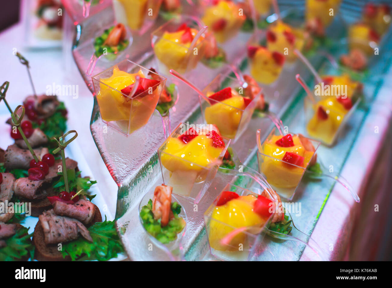 Beautifully decorated catering banquet table with different food snacks ...