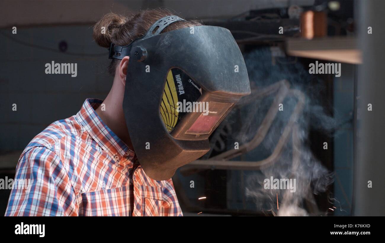 Man working in workshop welds hi-res stock photography and images - Alamy