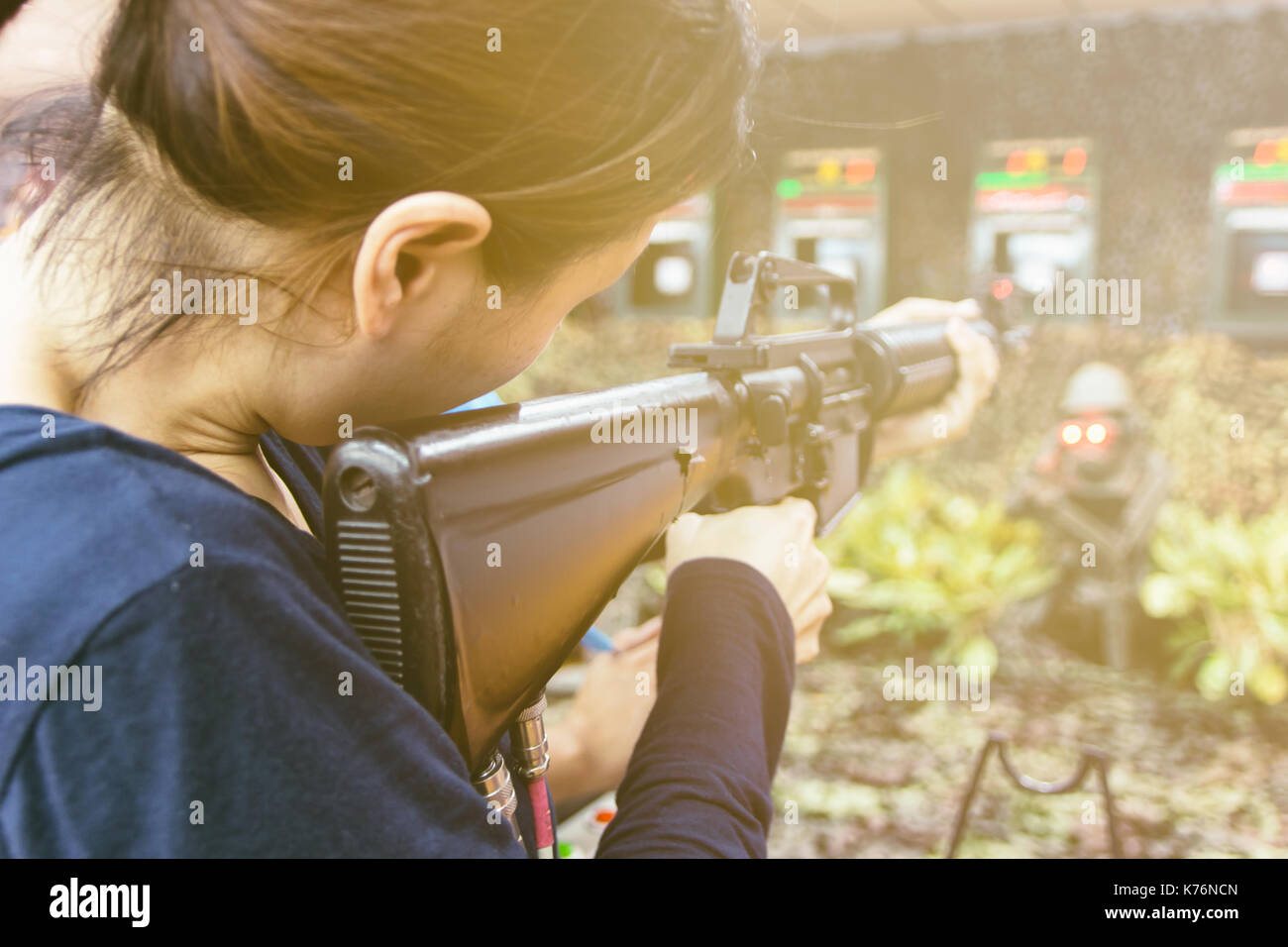close up with a woman and gun fire Stock Photo - Alamy