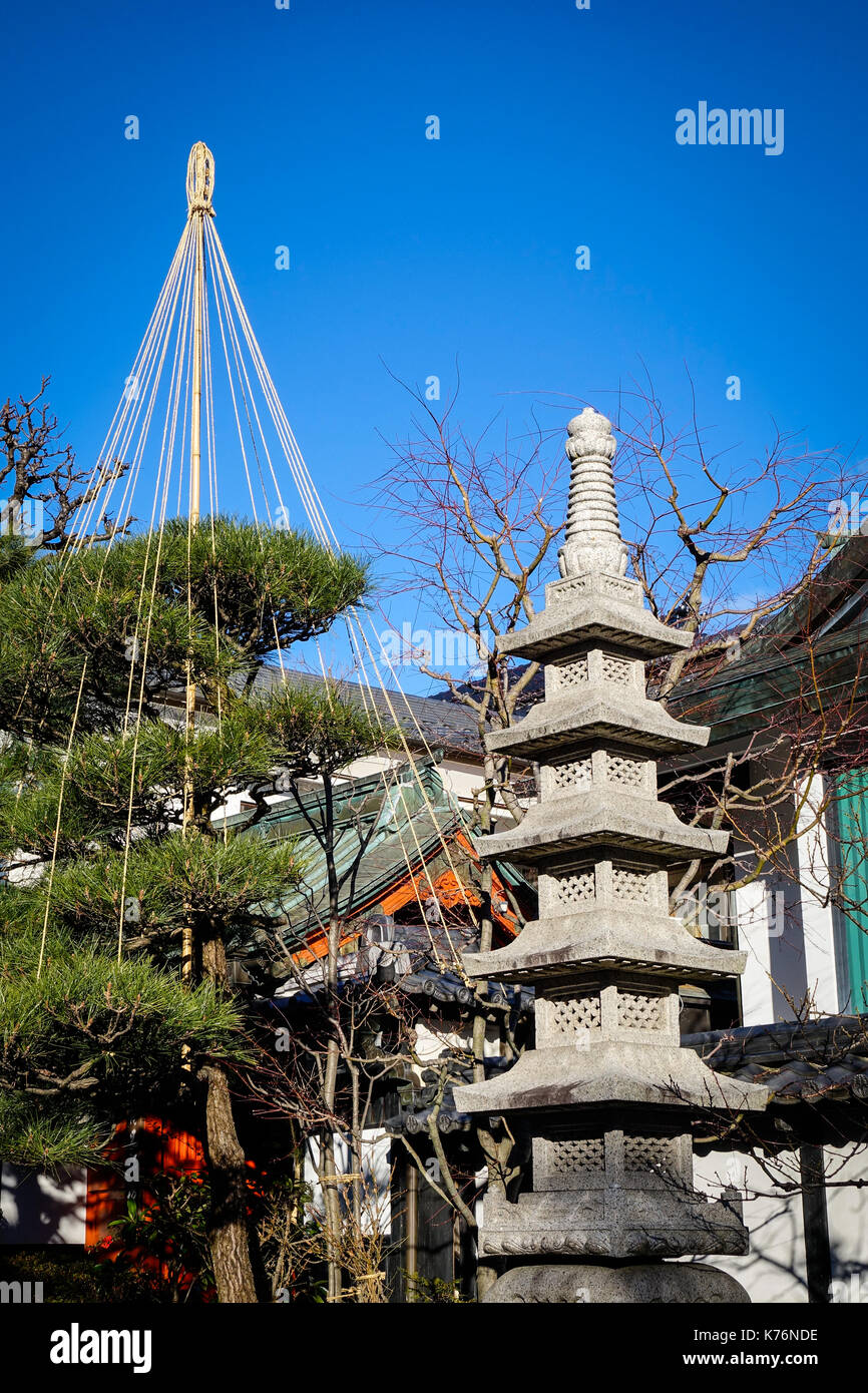Japanese garden with stone tower and pine trees in Nagano, Japan Stock ...