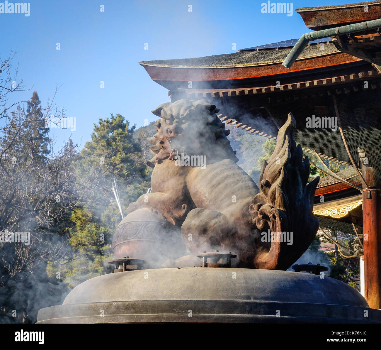 Lion statue at Zenkoji Temple in Nagano, Japan. Zenko-ji was founded ...