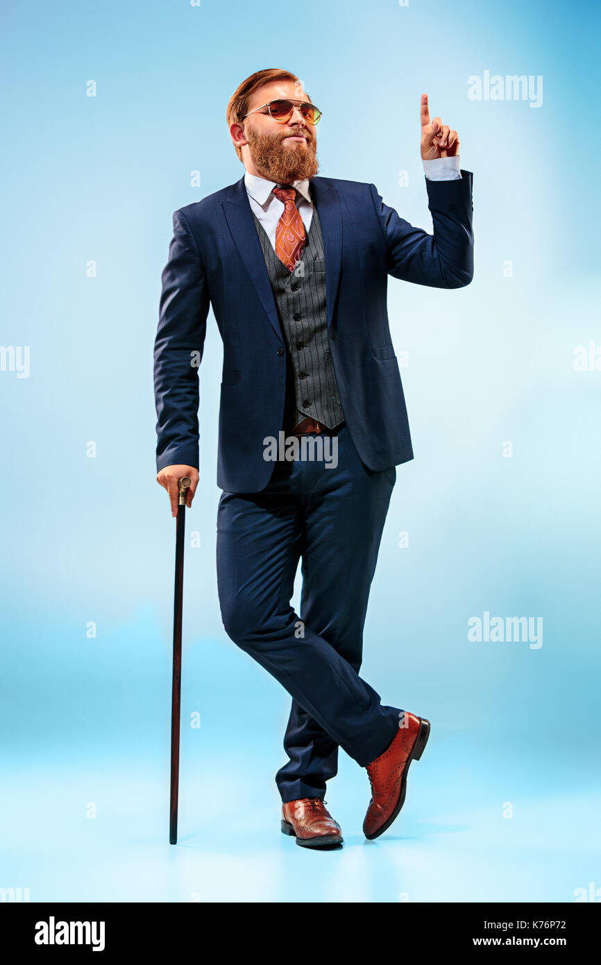 The barded man in a suit holding cane Stock Photo - Alamy