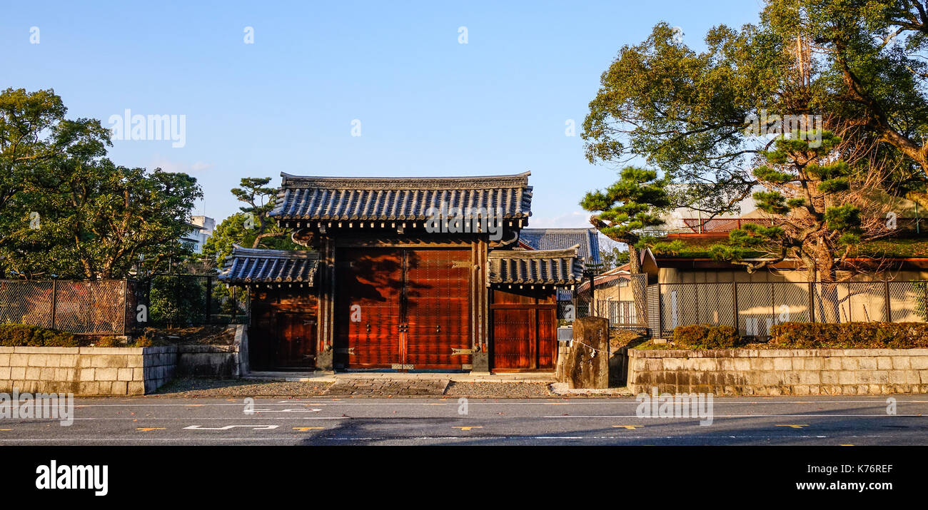 A wooden gate of the ancient palace at sunny day in Kyoto, Japan. Kyoto ...