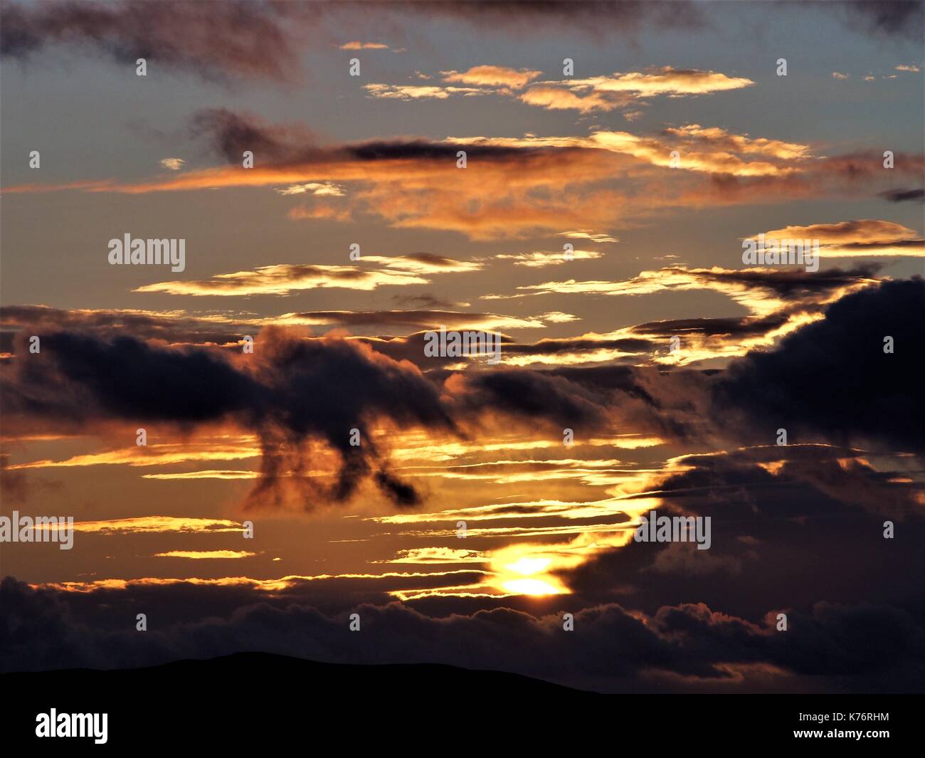 Clouds lit by the setting sun hi-res stock photography and images - Alamy