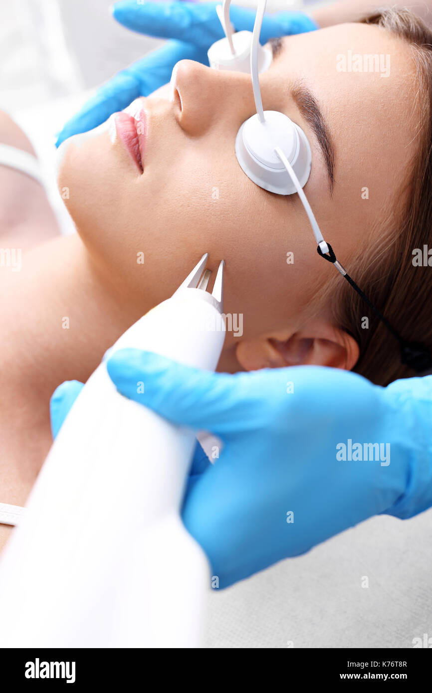 Laser removal of dye changes on the skin of the face Stock Photo - Alamy