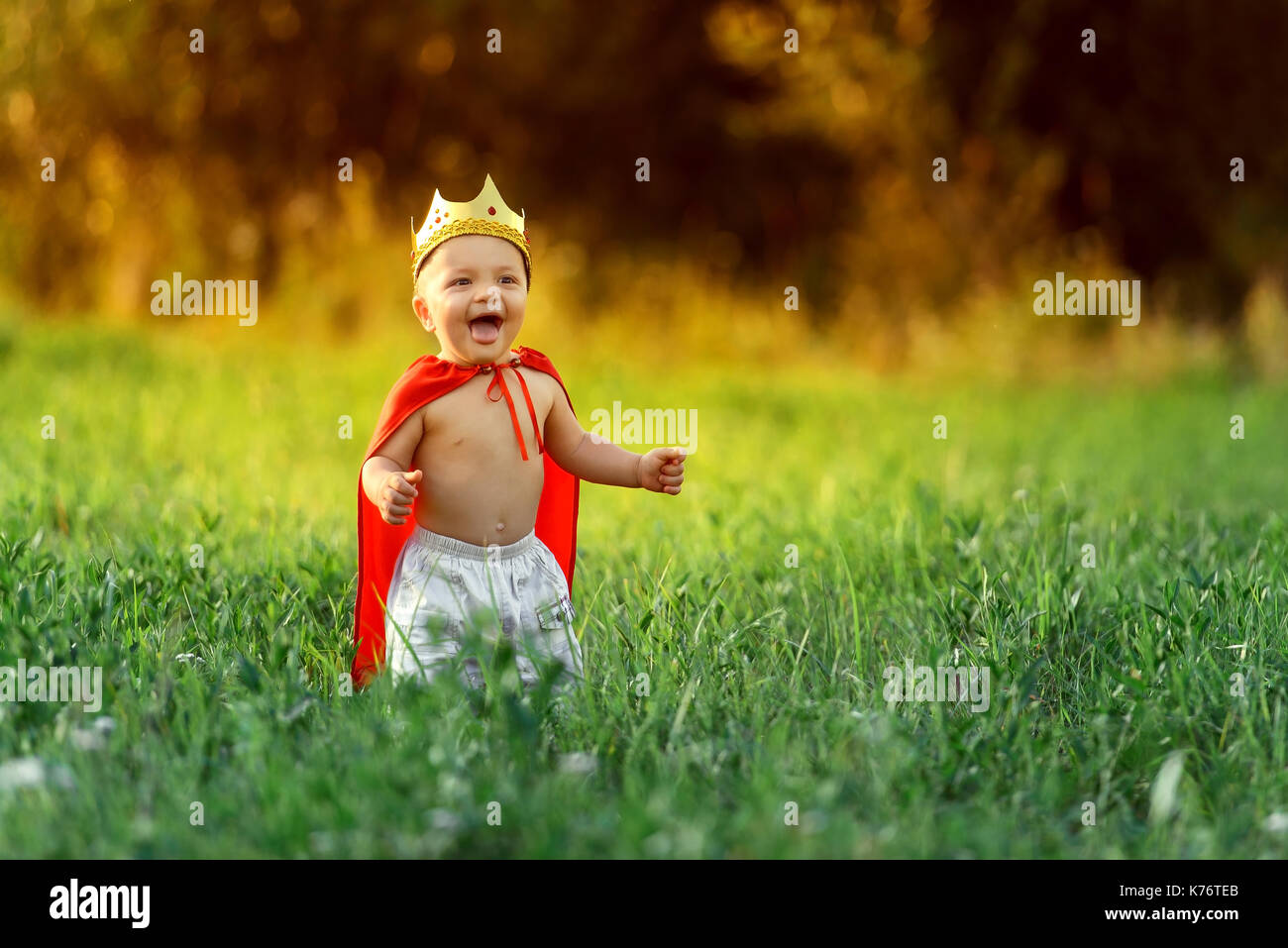 the little boy, the child king is laughing on a summer evening Stock ...