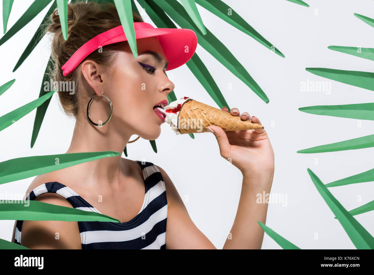 fashionable woman eating ice cream Stock Photo - Alamy