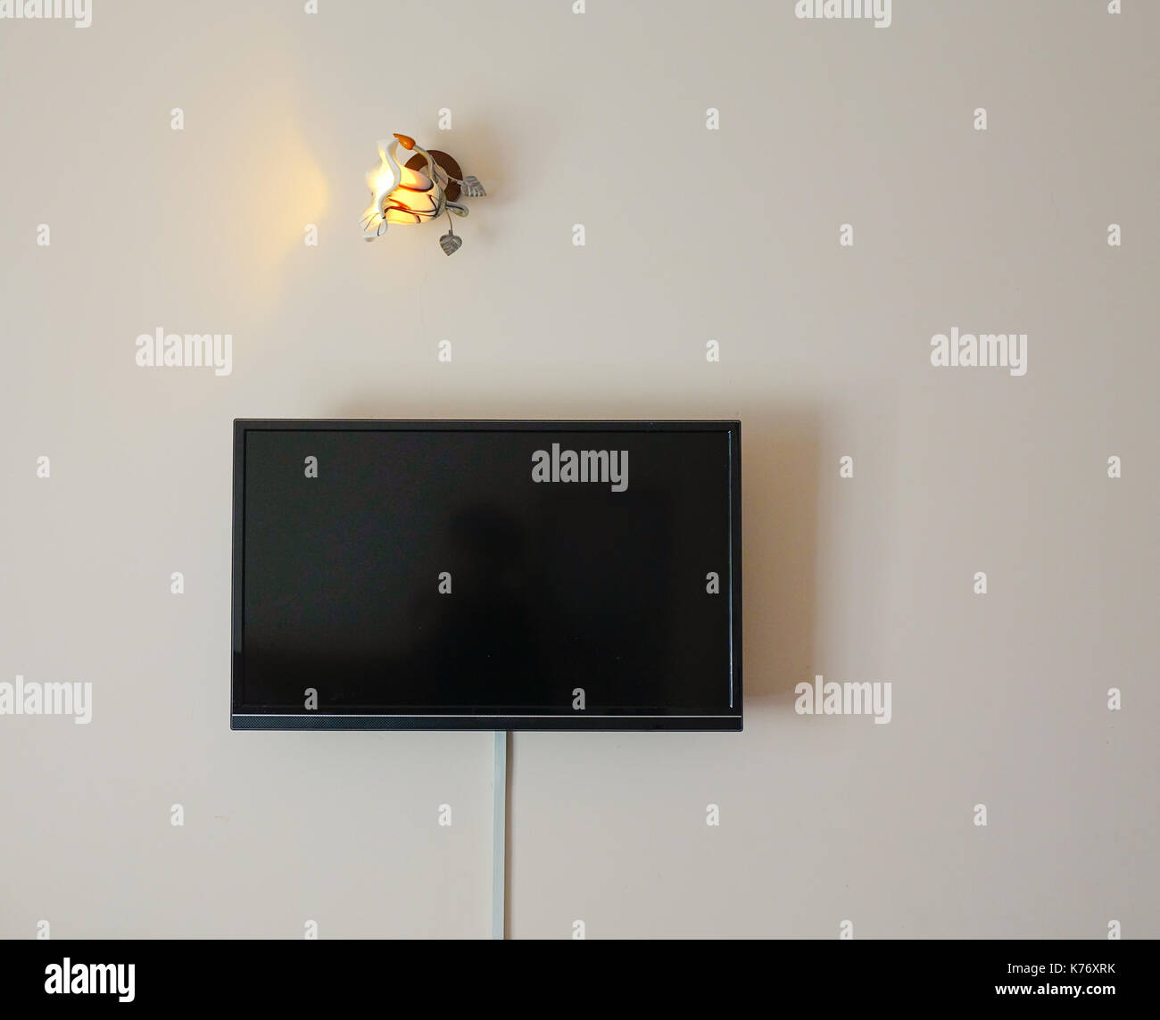 Black LED tv television screen hanging on the wall in an old room Stock ...