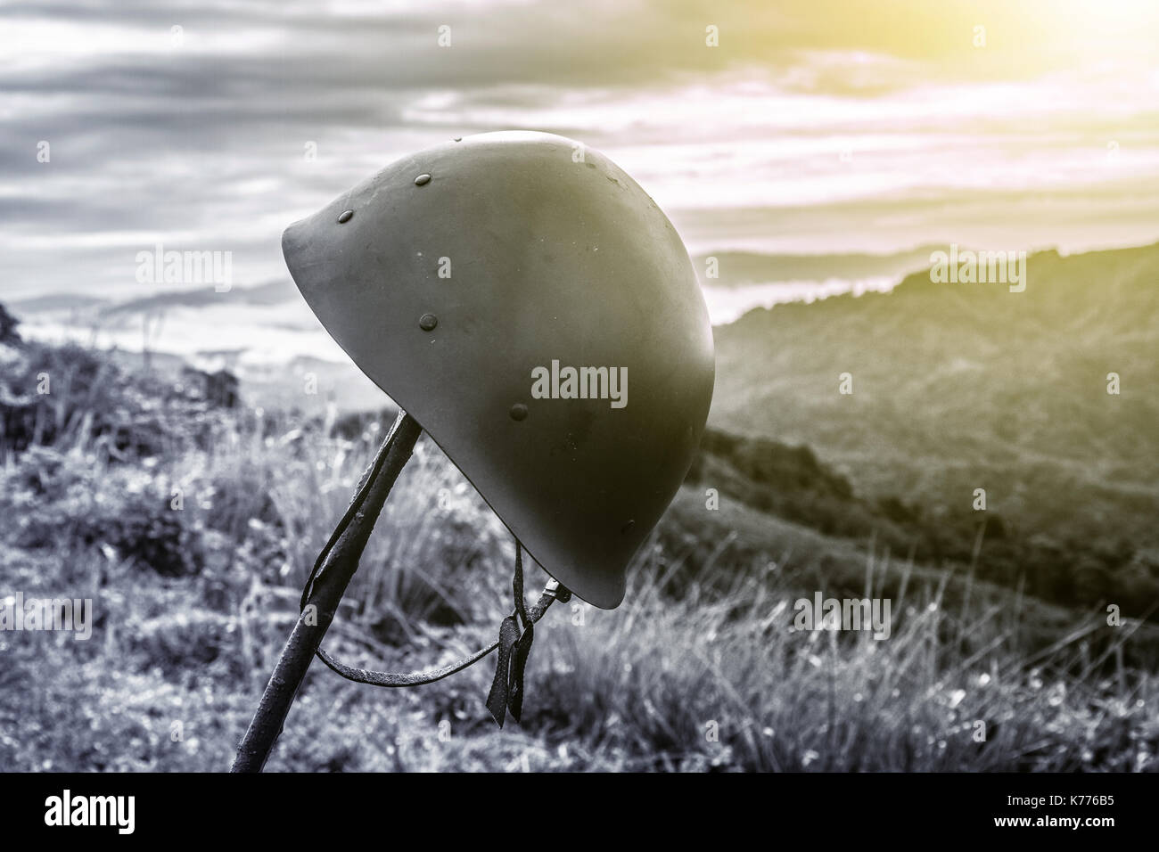 World War 2 military helmet hanging on wooden handle Vintage Stock ...
