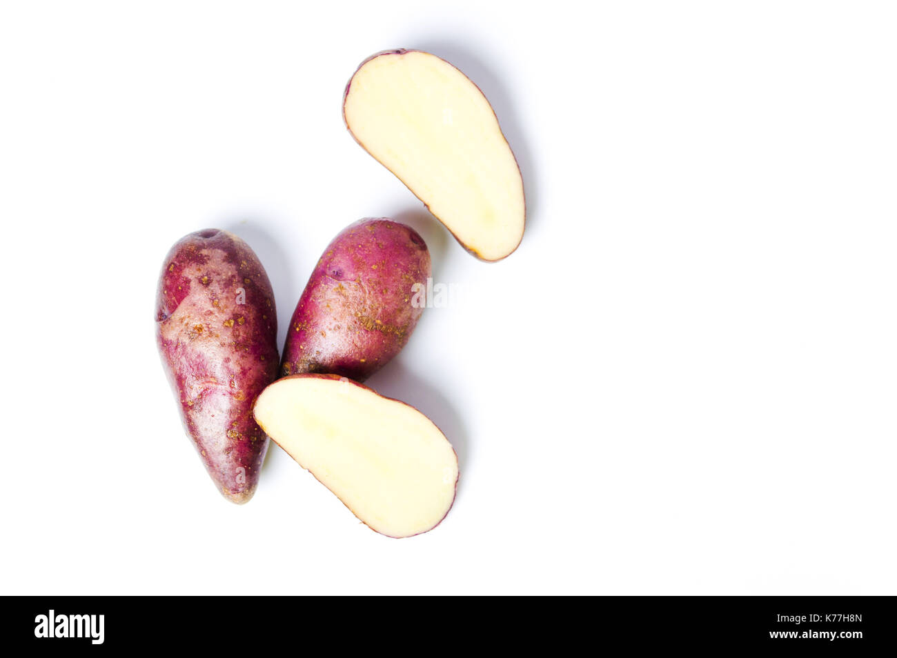 Raw red potatoes isolated on white background Stock Photo - Alamy