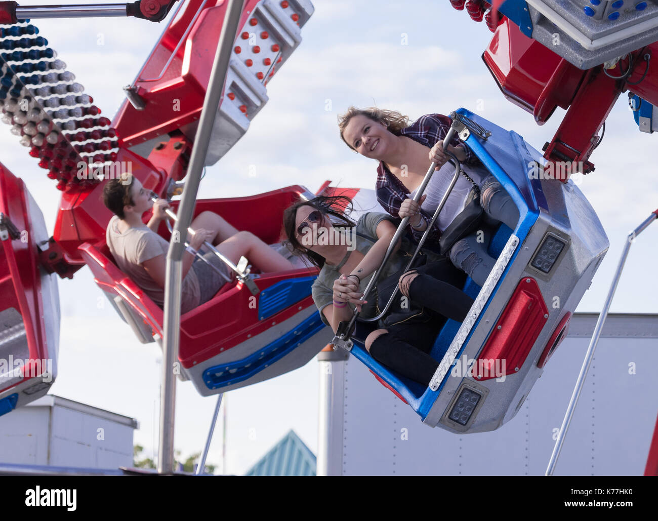 Landscape and portrait images of the midway, rides and games at an ...