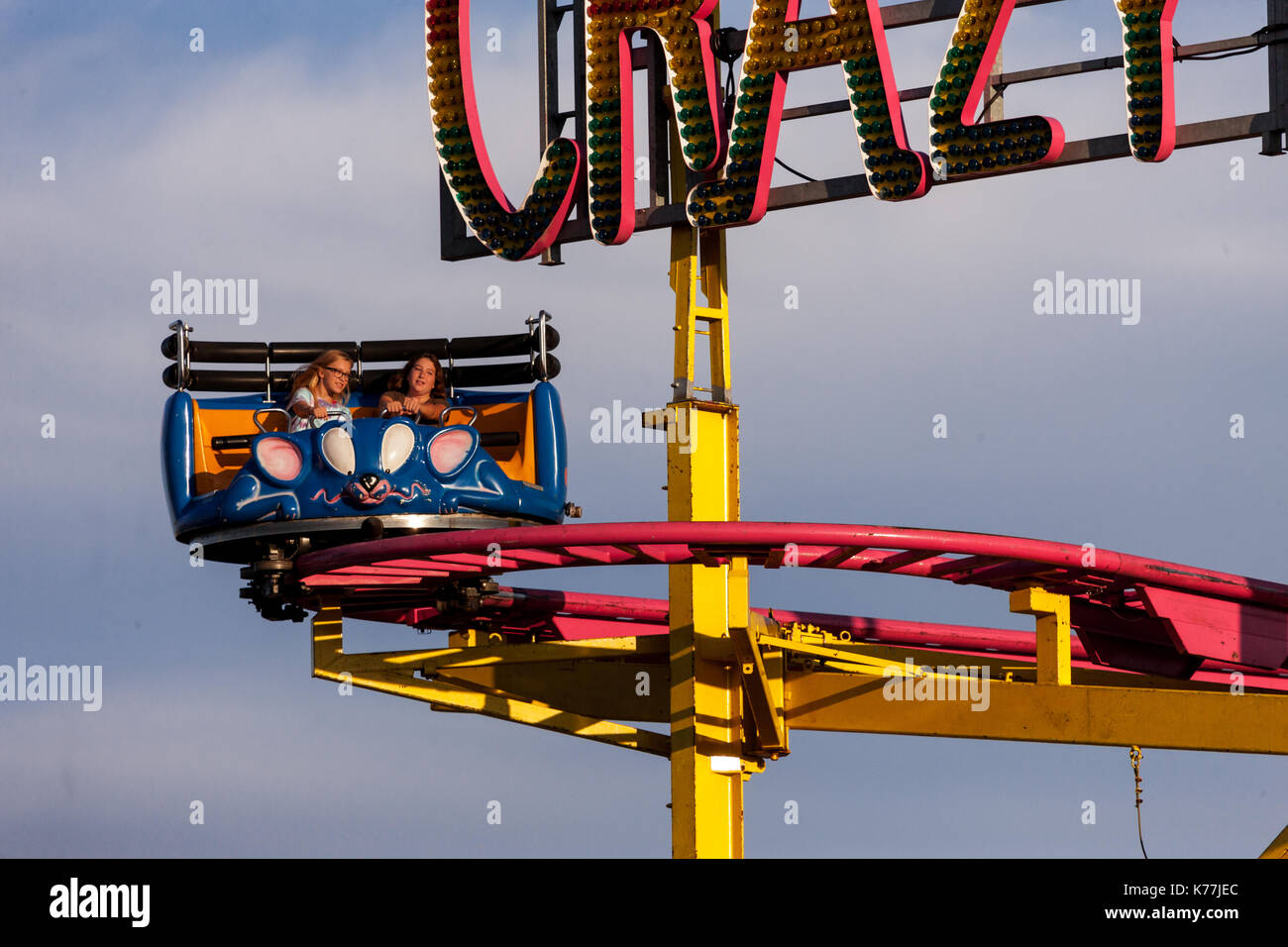 Landscape and portrait images of the midway, rides and games at an ...