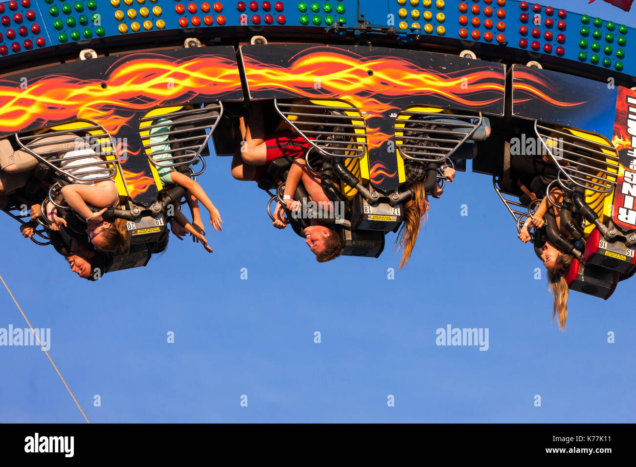 Landscape and portrait images of the midway, rides and games at an ...