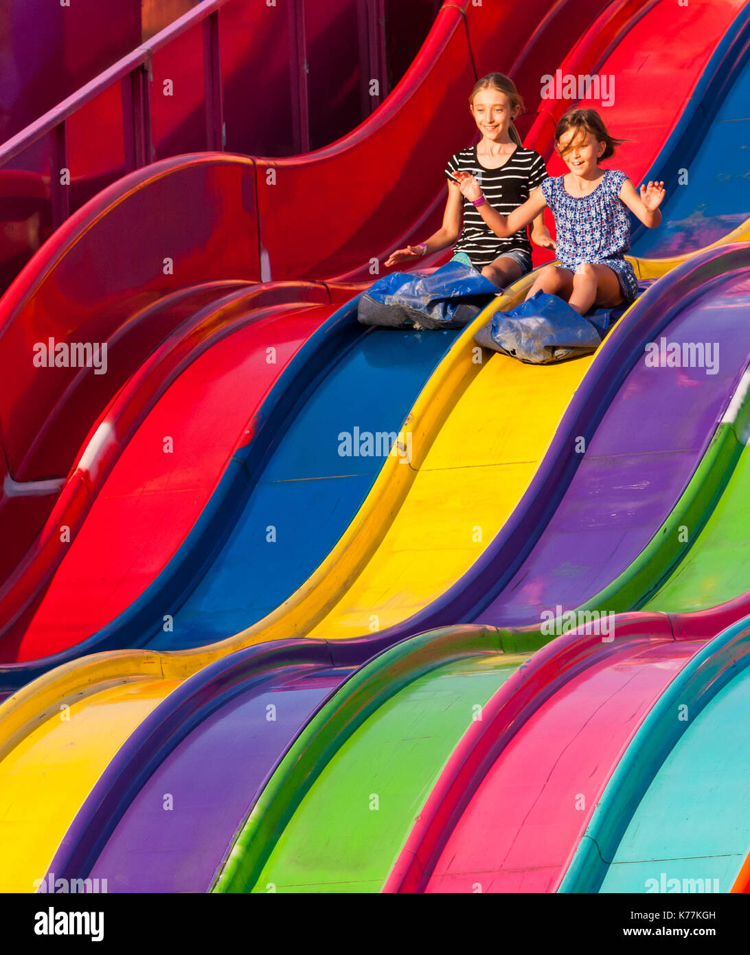 Landscape and portrait images of the midway, rides and games at an ...