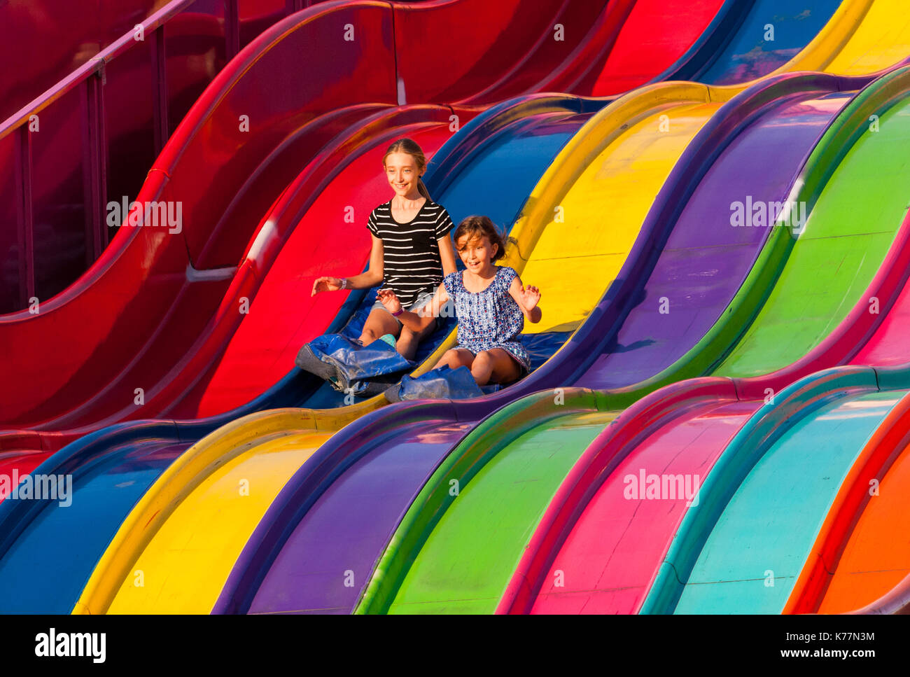 Landscape and portrait images of the midway, rides and games at an ...