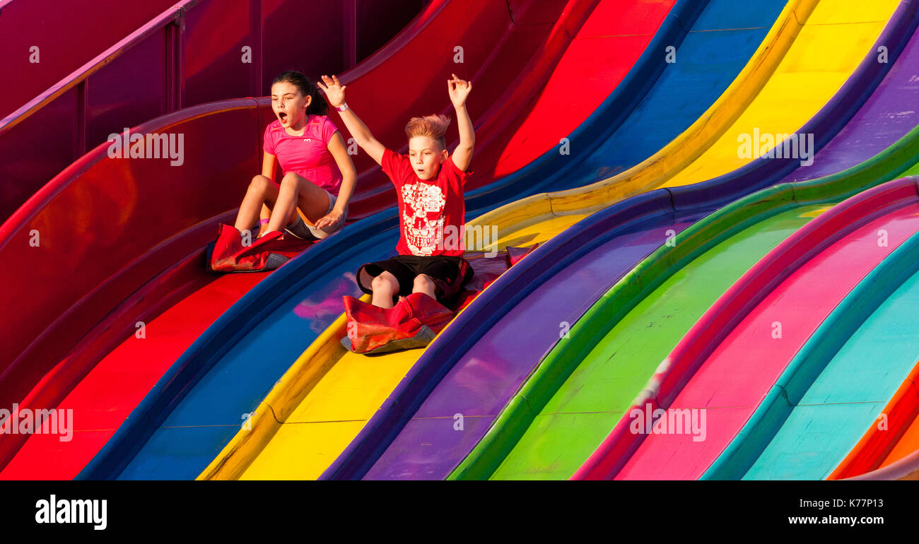 Landscape and portrait images of the midway, rides and games at an ...