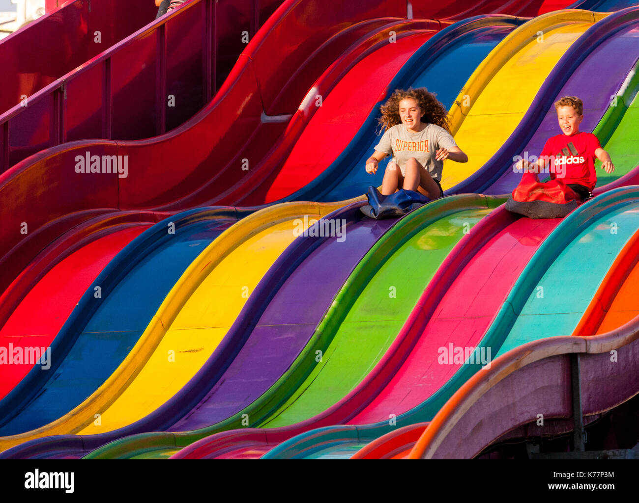 Landscape and portrait images of the midway, rides and games at an ...