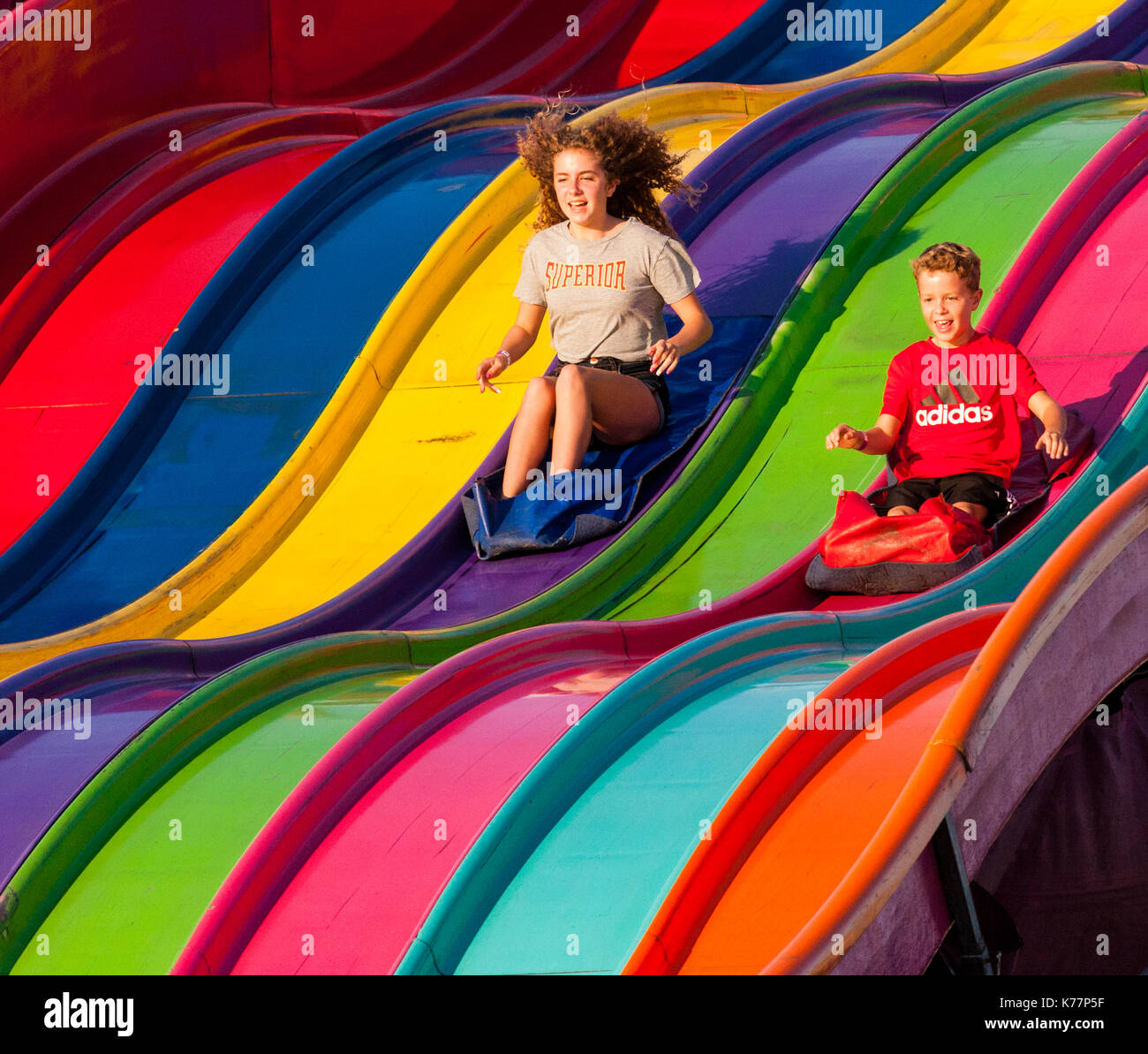 Landscape and portrait images of the midway, rides and games at an ...