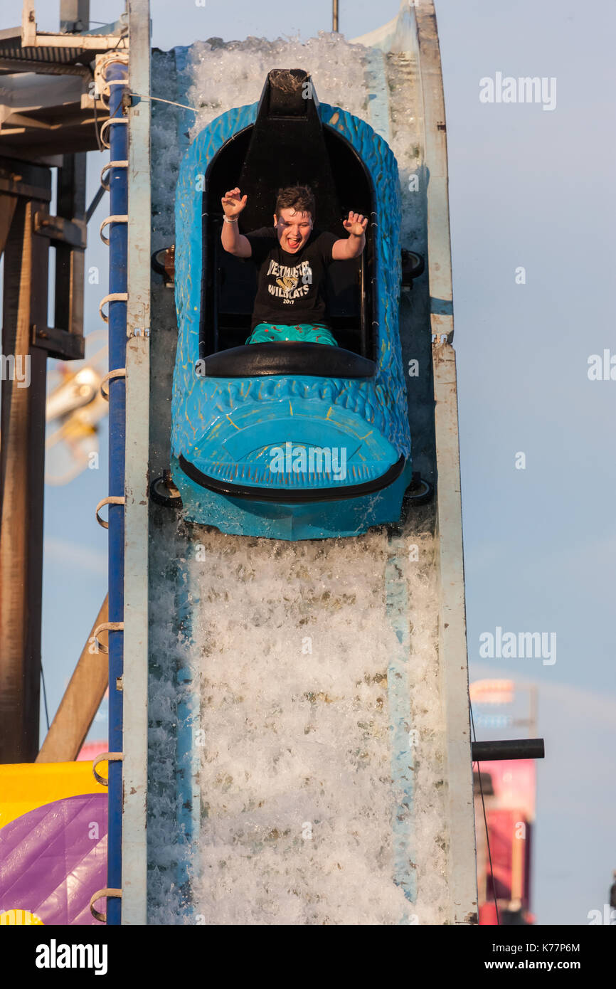 Landscape and portrait images of the midway, rides and games at an ...
